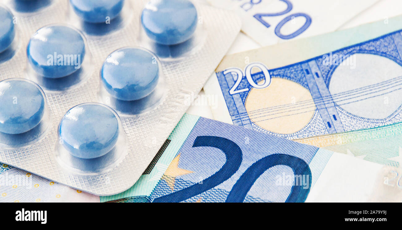 Medication Pills with Euro money Stock Photo - Alamy