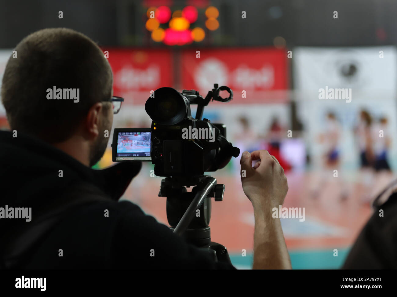 professional cameraman filming sport Stock Photo - Alamy