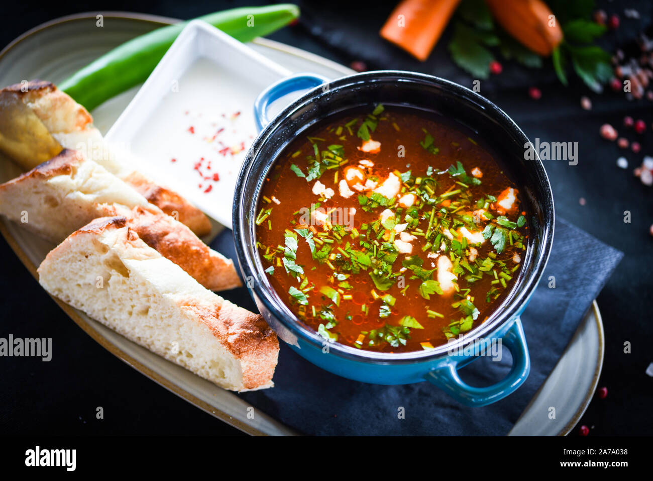 romanian traditional turkey soup with fresh vegetables, wipe cream ...