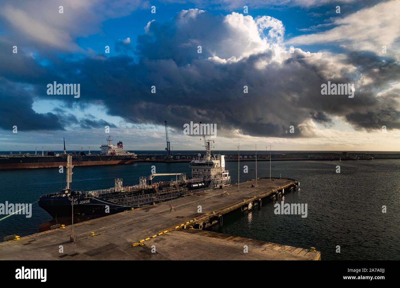 A picture of the Ponta Delgada Port at sunset Stock Photo - Alamy