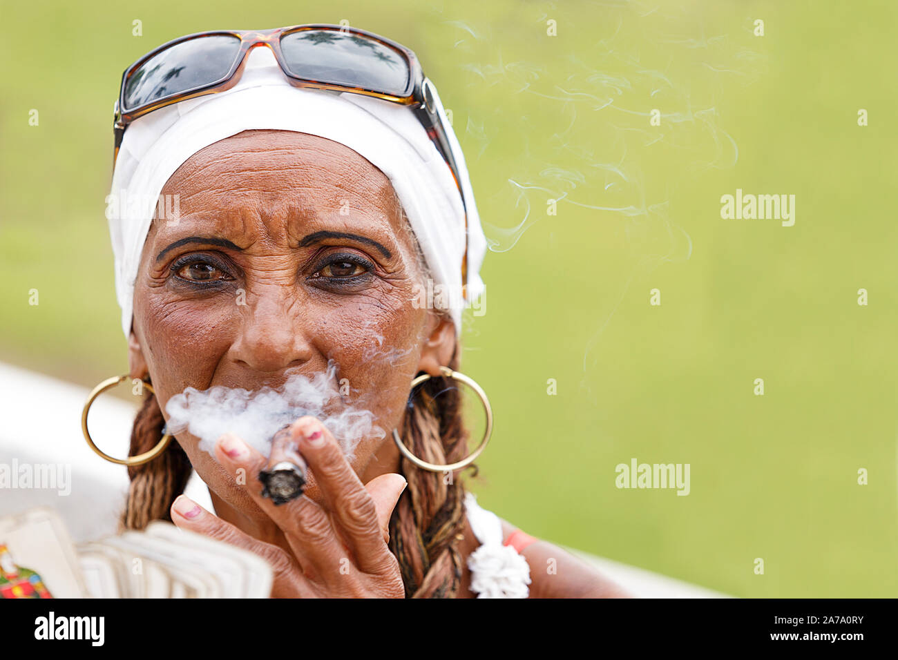Cuban woman smoking a cigar hi-res stock photography and images - Alamy