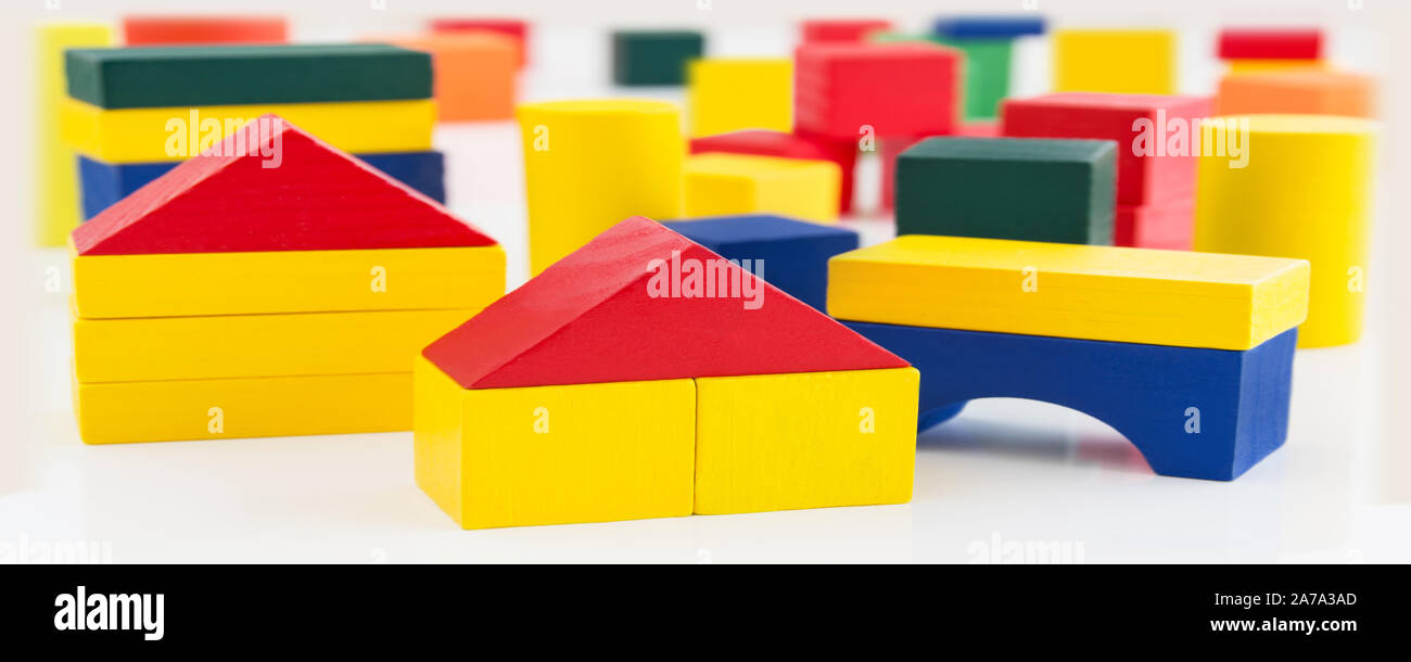 Coloured building blocks on white background Stock Photo - Alamy