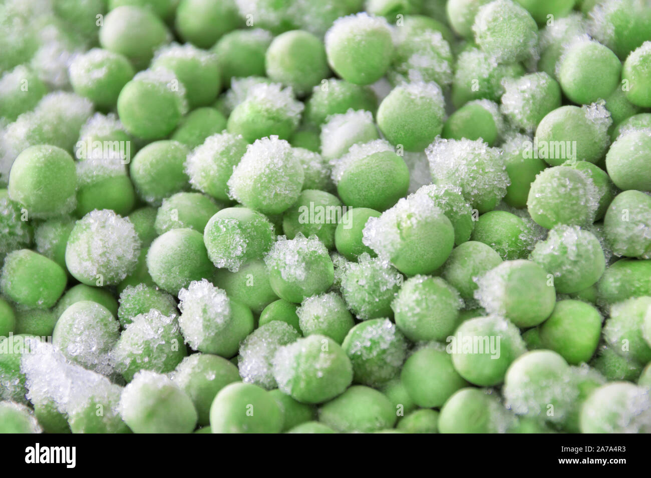 Frozen peas close-up background Stock Photo - Alamy