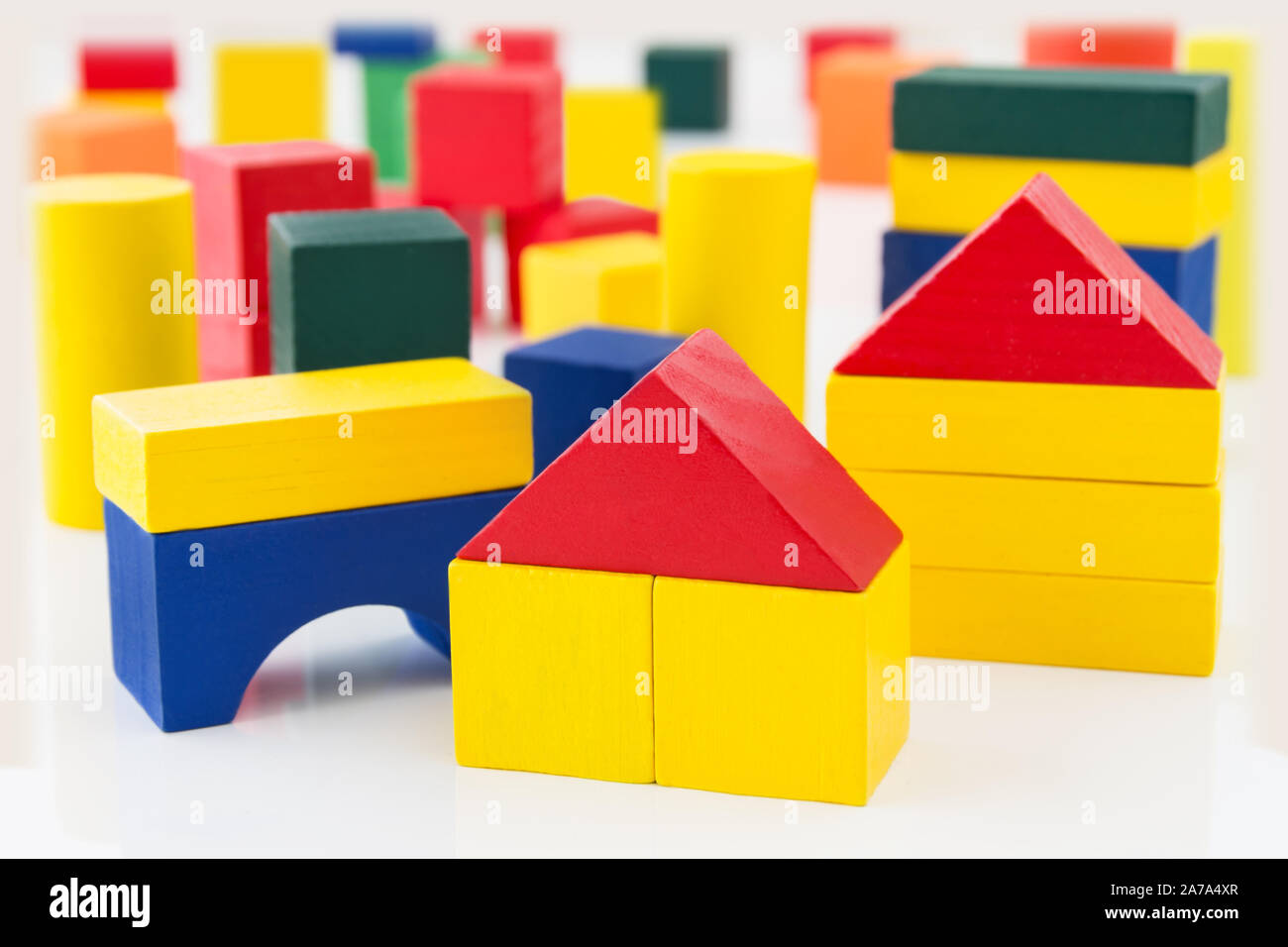 Coloured building blocks on white background Stock Photo - Alamy