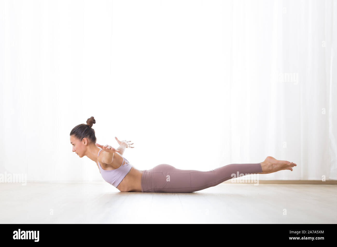 Locust pose yoga hi-res stock photography and images - Alamy