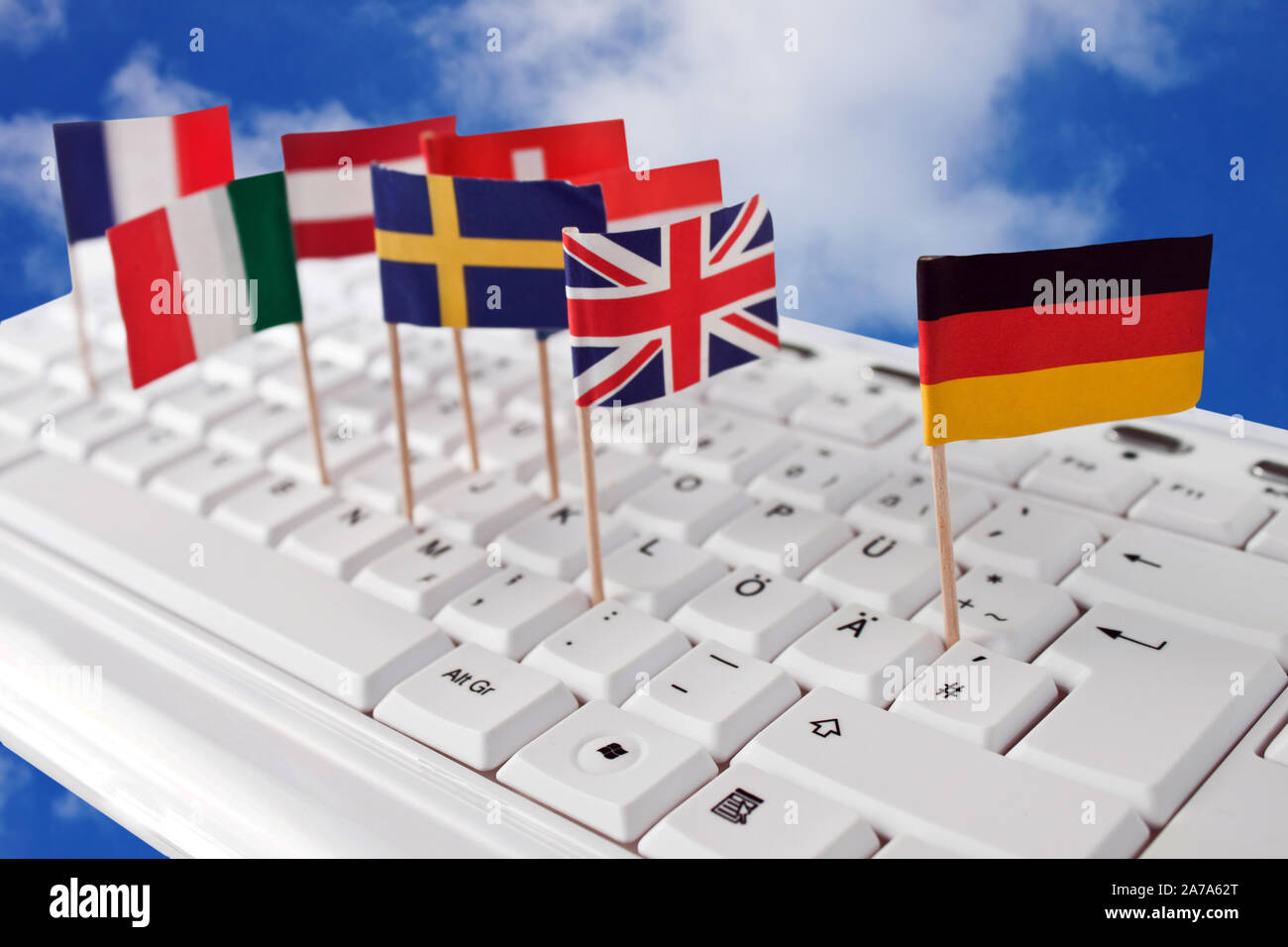 Keyboard with european flags and sky as background Stock Photo - Alamy