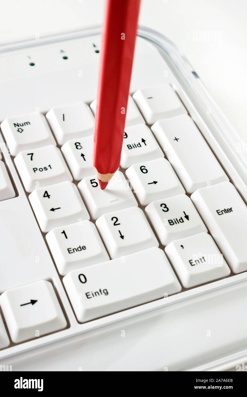 Keyboard numeric keypad with red coloured pencil Stock Photo - Alamy
