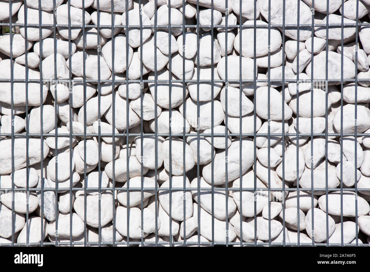Gabion White brick wall as background Stock Photo - Alamy