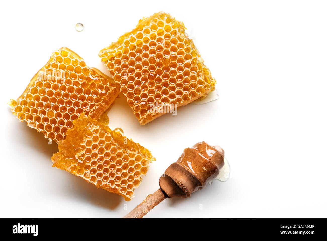 Fresh honeycomb with honey spoon isolated on white background Stock ...