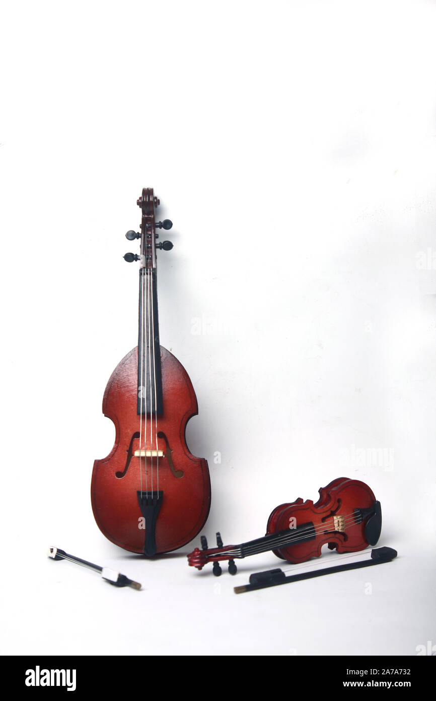 violin and bass-viol on white background Stock Photo - Alamy