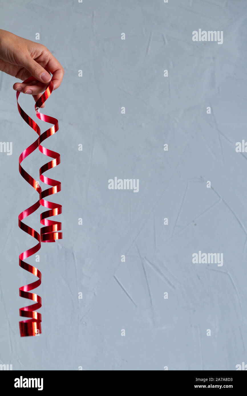 Woman hand is holding red confetti Stock Photo - Alamy