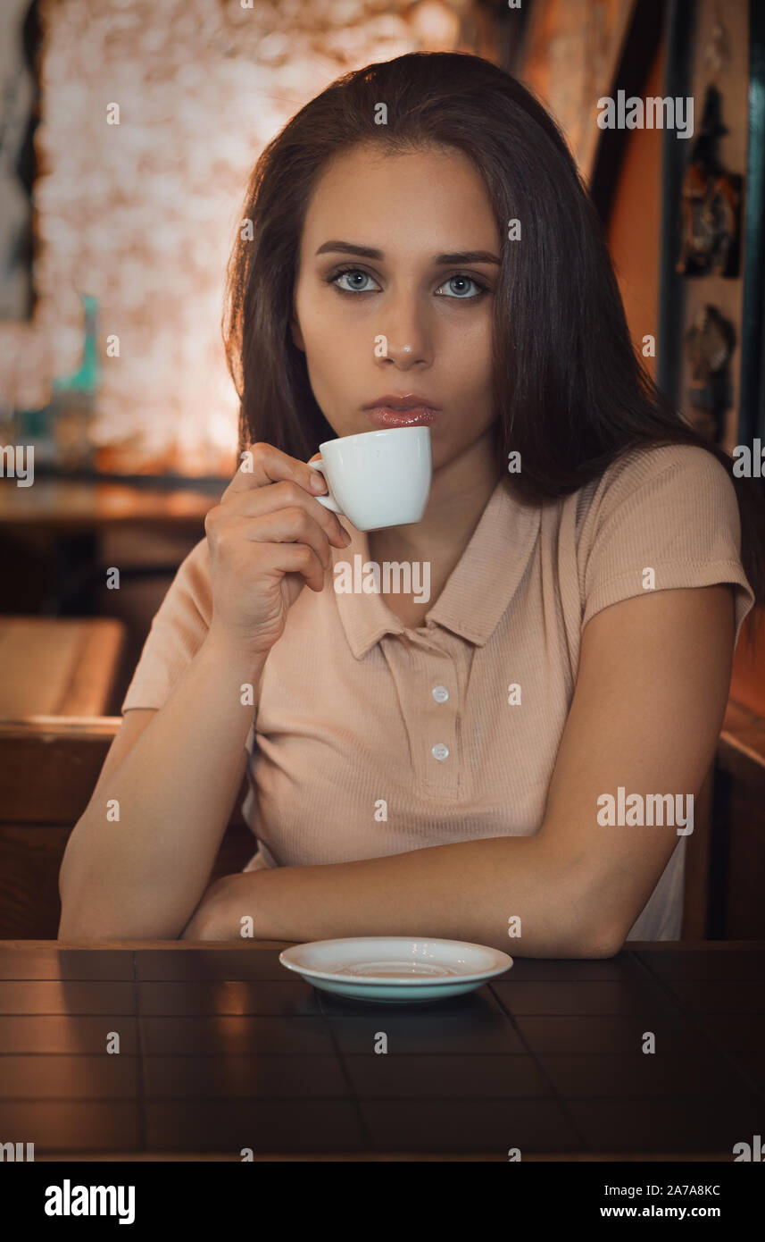 girl in a bar taking a coffee Stock Photo - Alamy