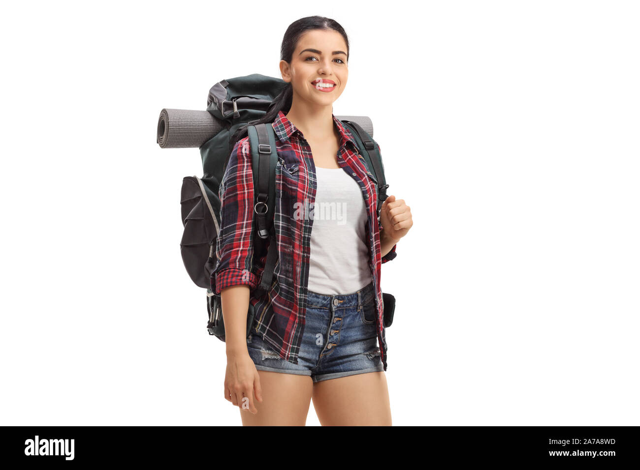 Young female hiker with backpack smiling at the camera isolated on ...