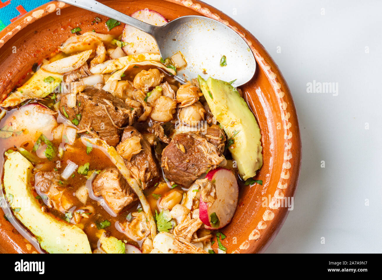Red pozole, a traditional Mexican stew made with pork and hominy corn ...