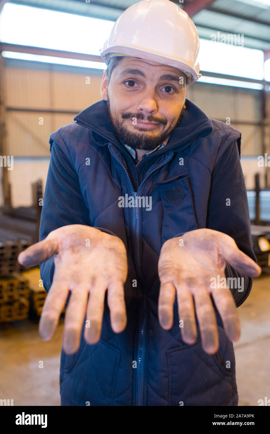 worker showing his dirty hands Stock Photo - Alamy