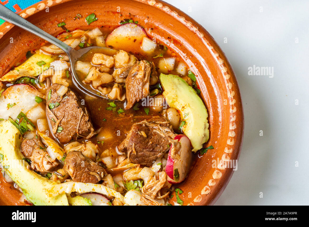 Red pozole, a traditional Mexican stew made with pork and hominy corn ...