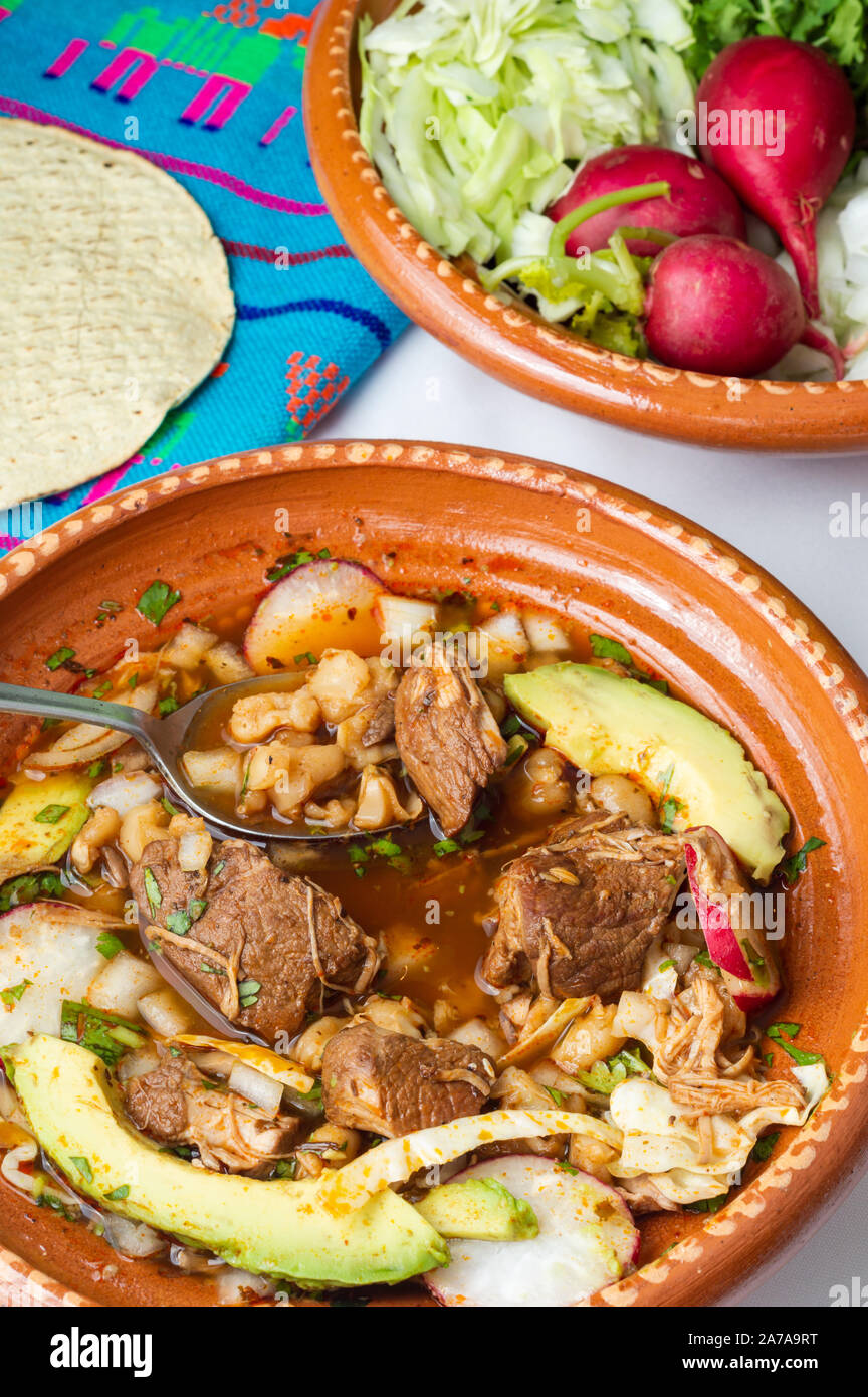 Red pozole, a traditional Mexican stew made with pork and hominy corn ...