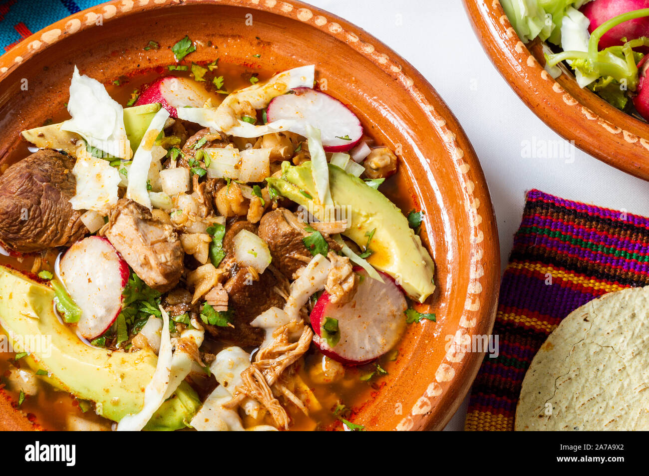 Red pozole, a traditional Mexican stew made with pork and hominy corn ...