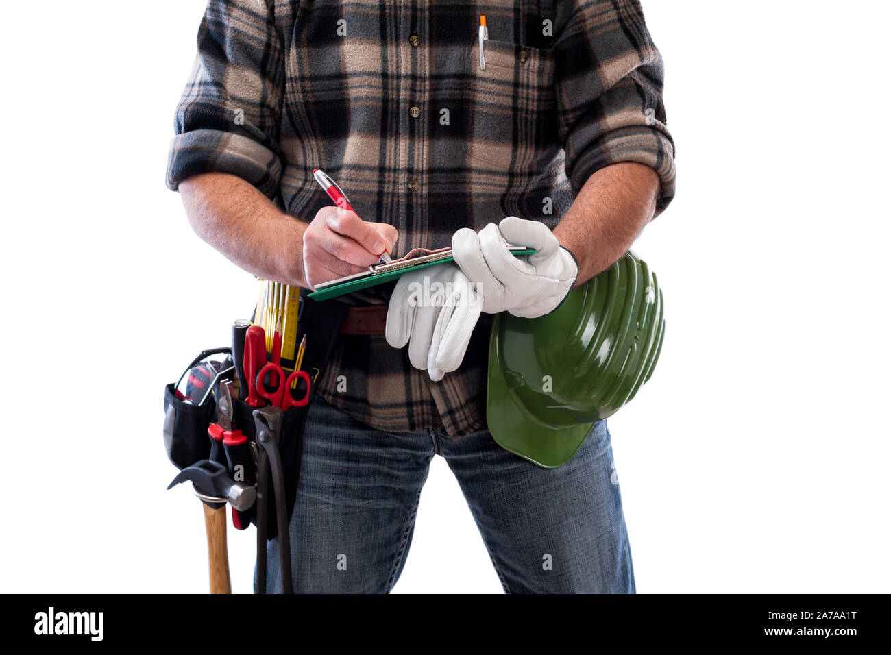 Carpenter isolated on white background writes work notes on a notebook ...