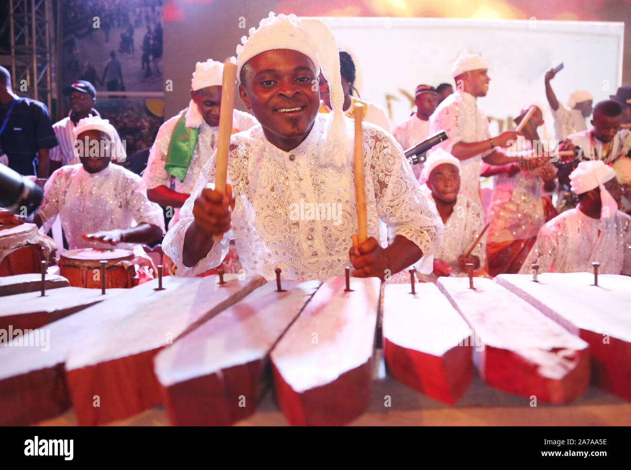African man beating his traditional xylophone at the festival during ...