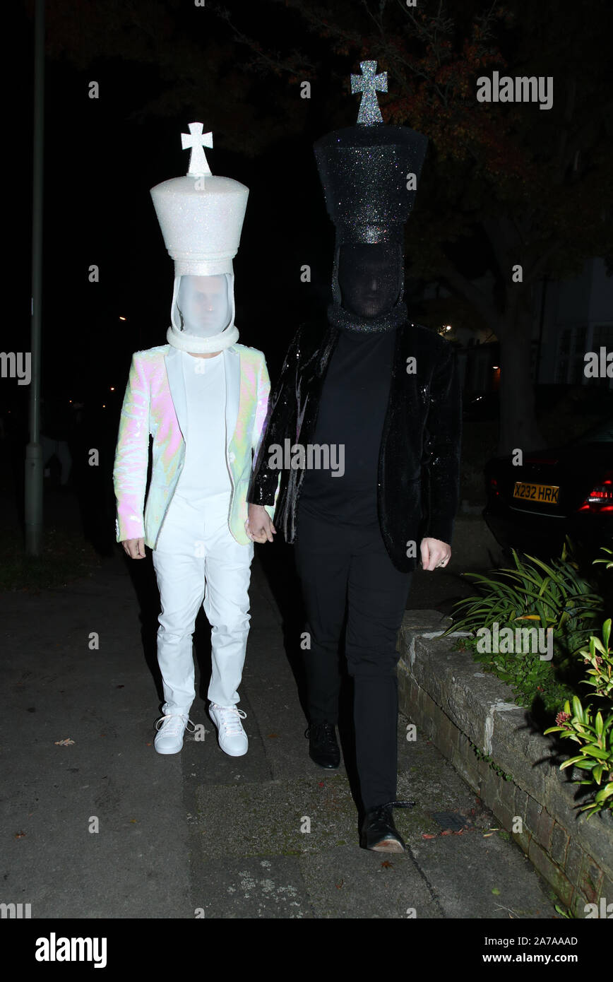 Guests arrive at a Halloween party hosted by Jonathan Ross at his house ...