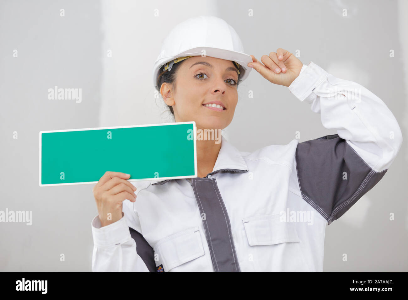 a female painter holding sign Stock Photo - Alamy