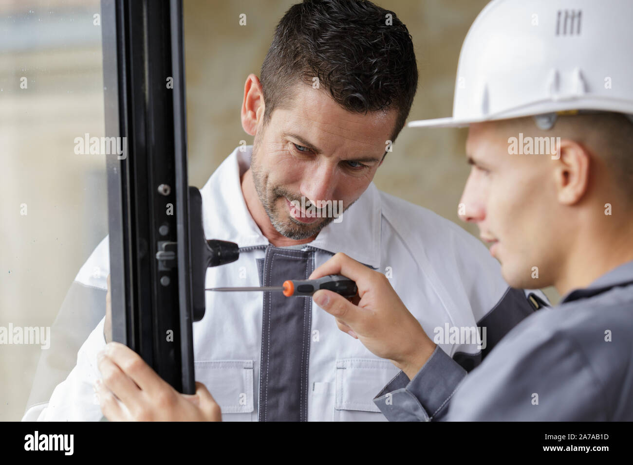 windows installation workers Stock Photo - Alamy