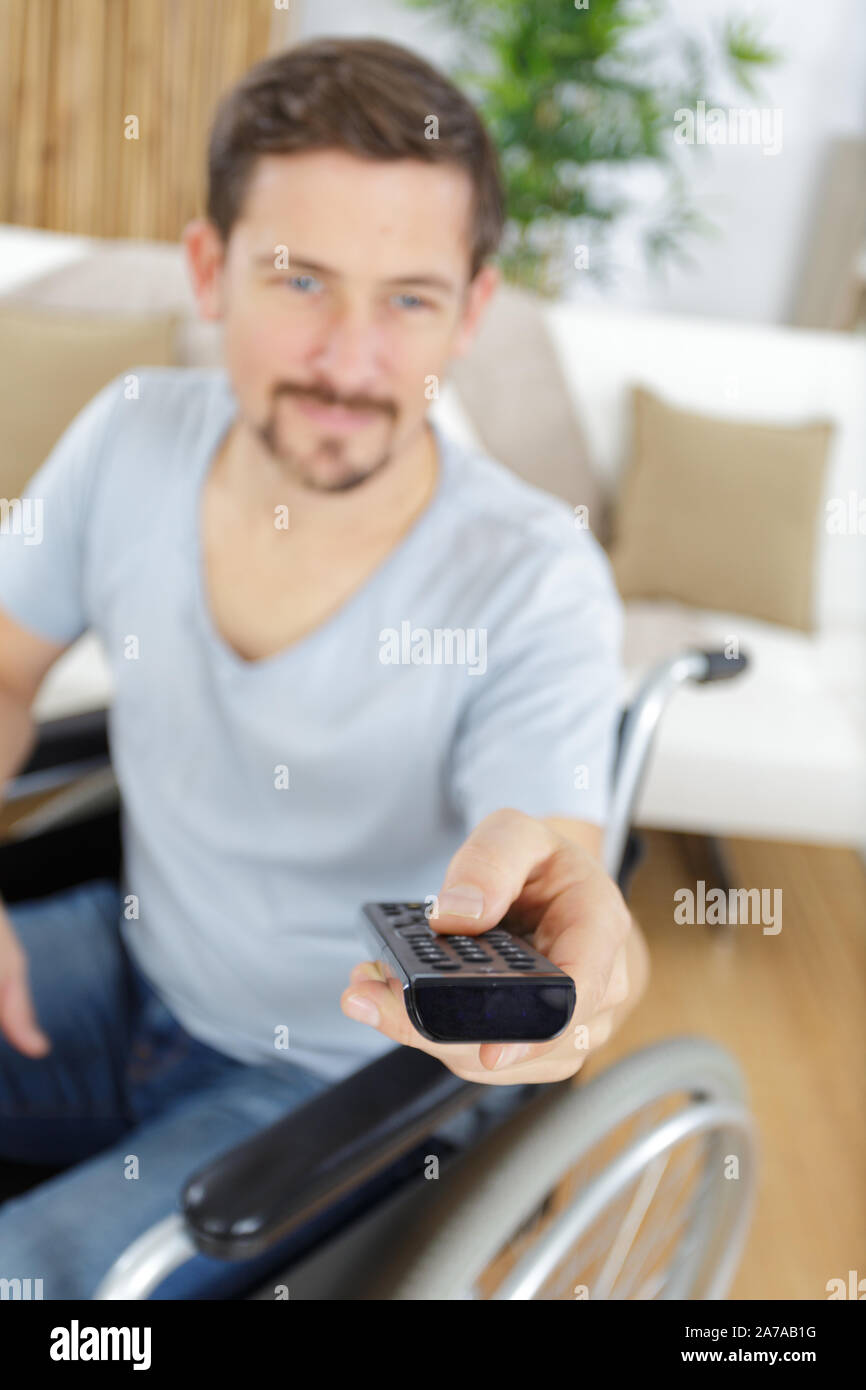 disabled man watching tv during rehabilitation Stock Photo - Alamy