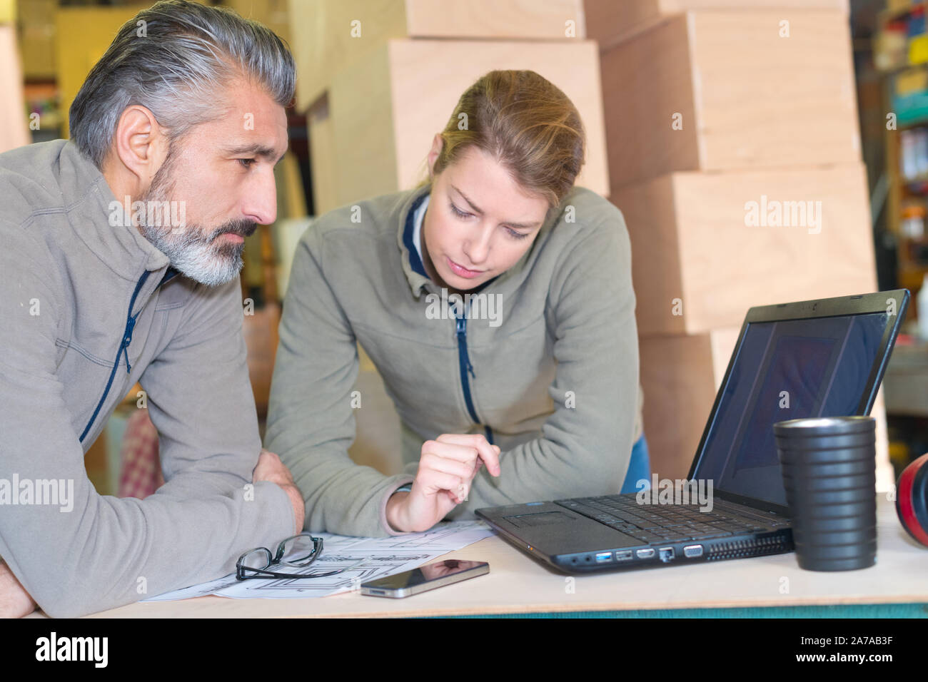 logistic employees checking the information Stock Photo - Alamy