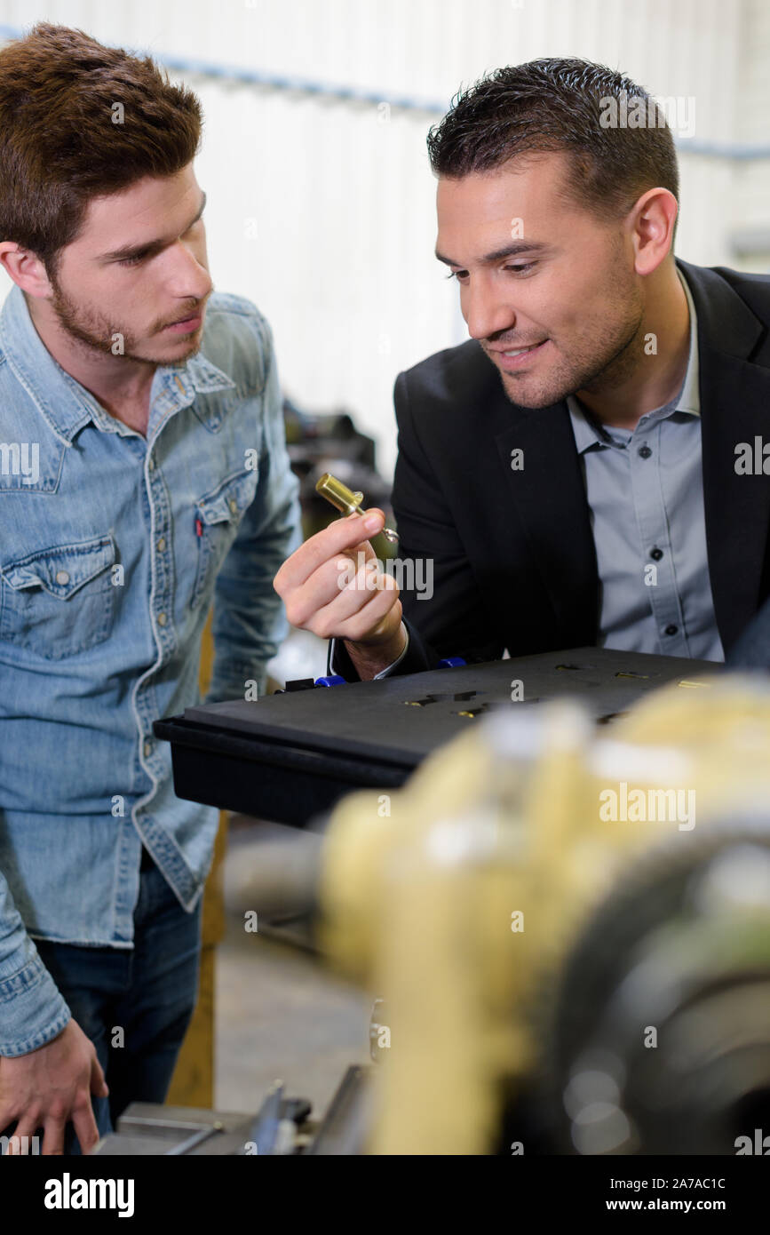team of mechanical parts product salesman Stock Photo - Alamy