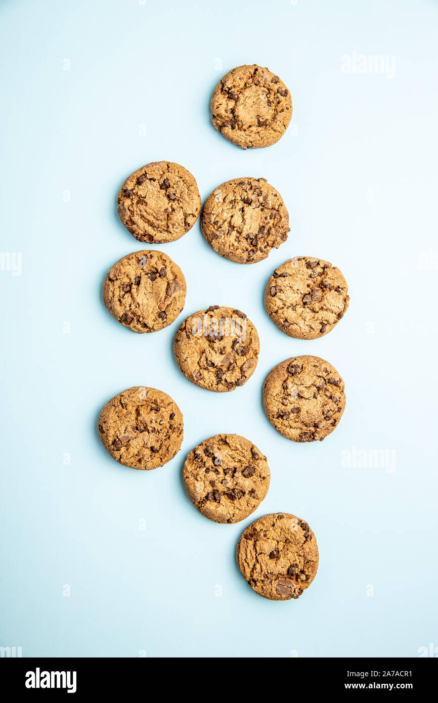 Sweet biscuits. Chocolate cookies on blue table. Top view Stock Photo ...