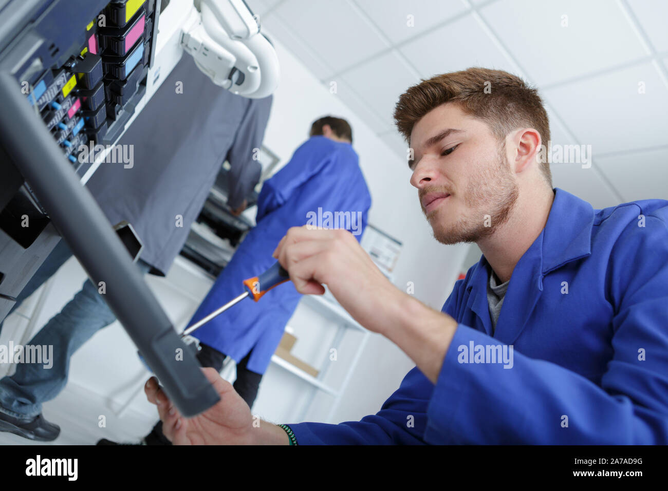 man fixing cartridge in printer machine at office Stock Photo - Alamy