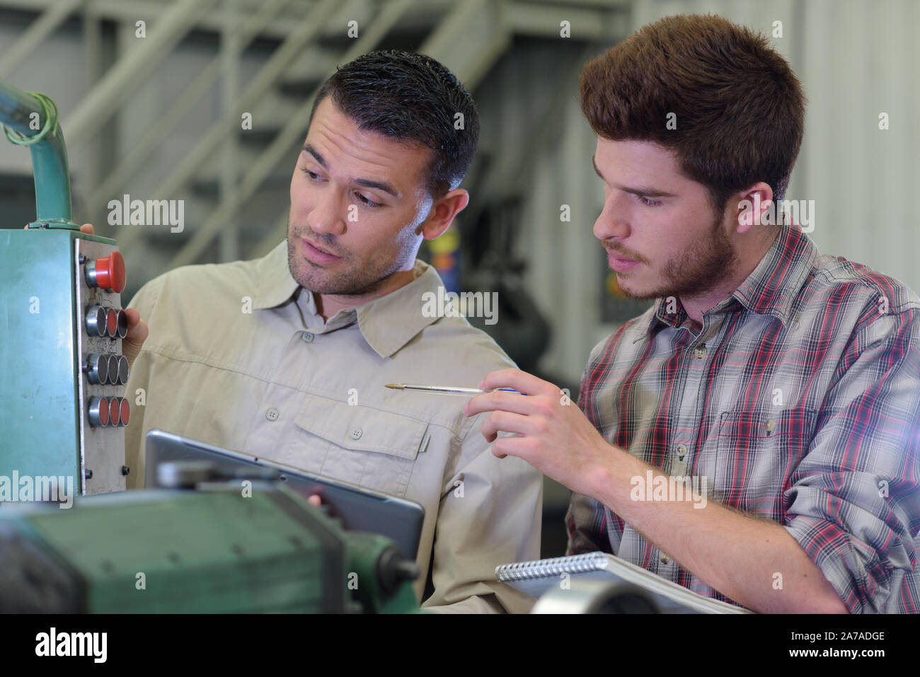 happy professional workers discussing something Stock Photo - Alamy