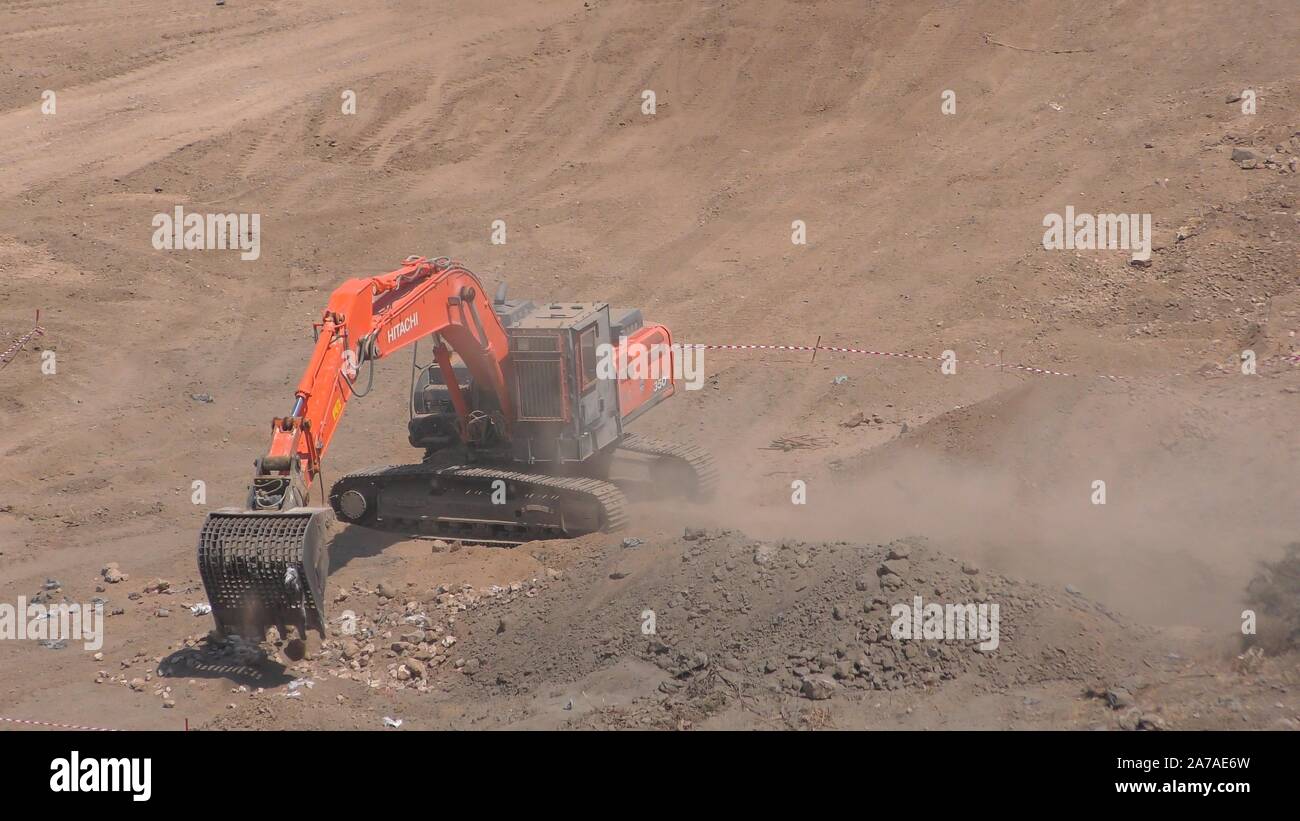 Enginers of 4M defense use an armored excavator with tillers and ...