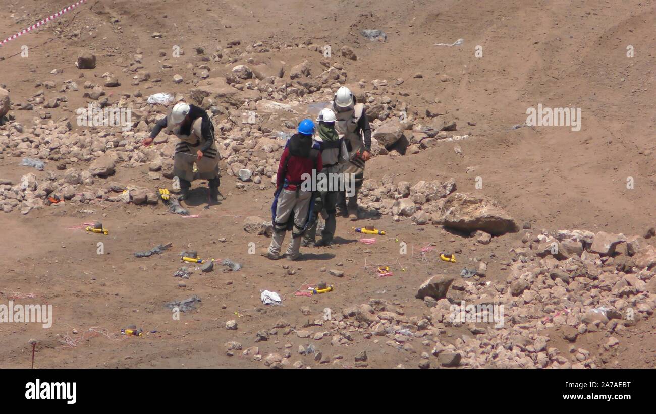 Enginers of 4M defense with protective gear attach explosives to mines ...