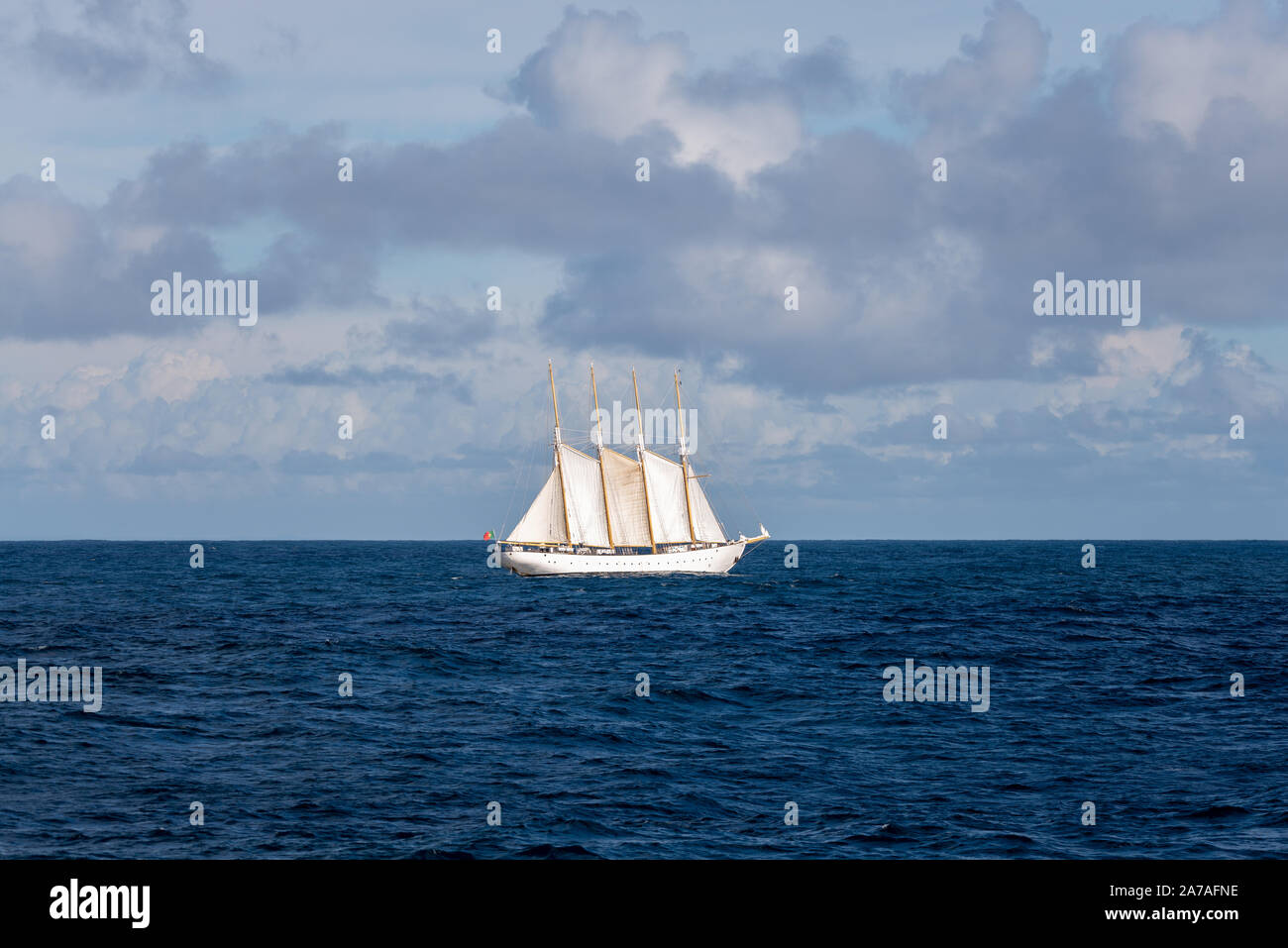 Sailing ship with four white sails Stock Photo - Alamy
