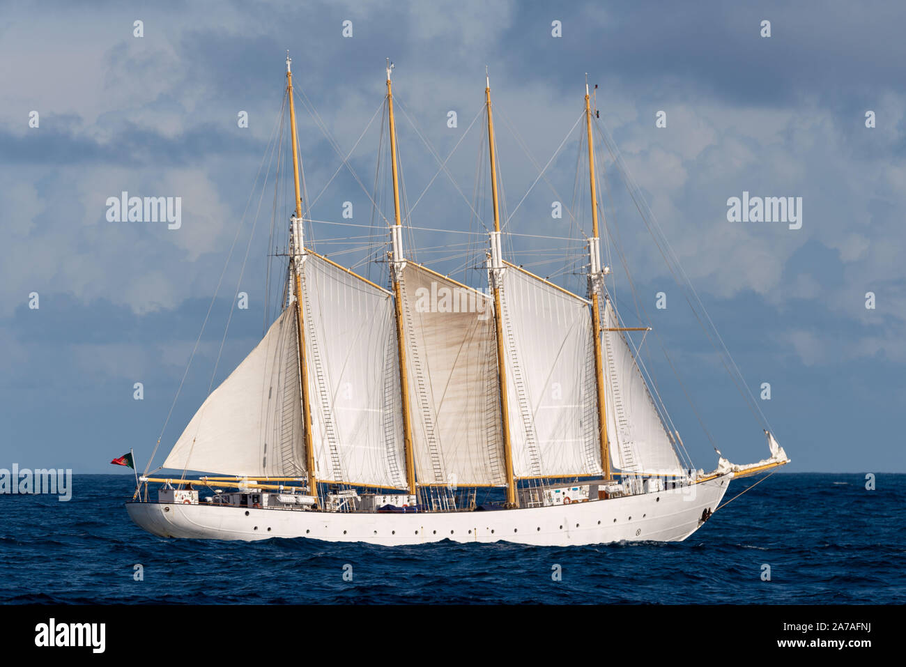 Sailing ship with four white sails Stock Photo - Alamy