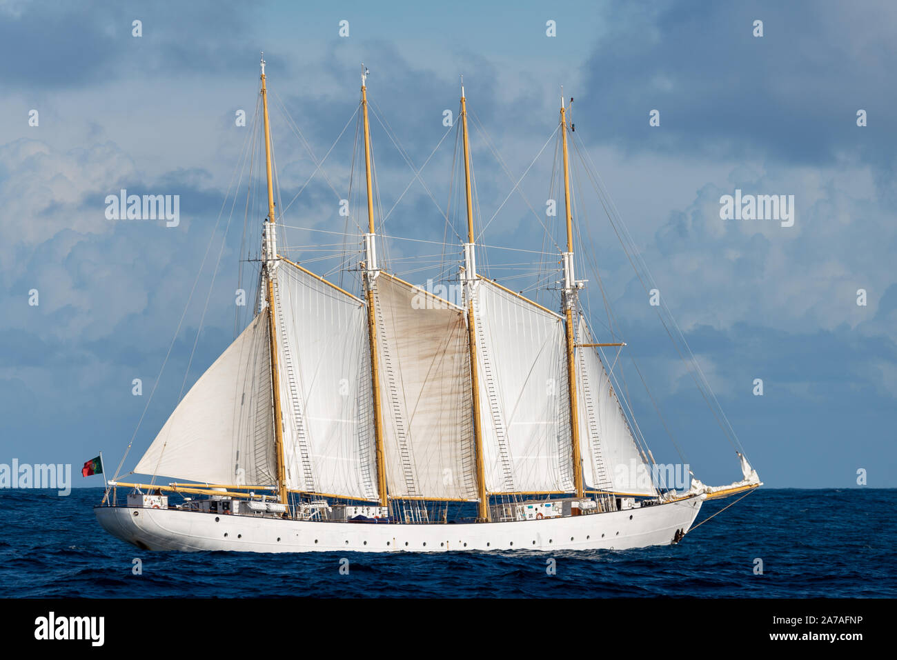 Sailing ship with four white sails Stock Photo - Alamy