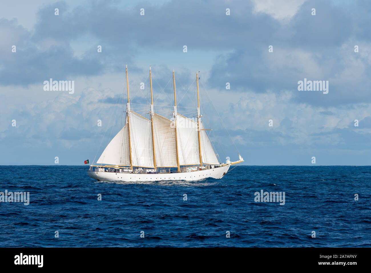 Sailing ship with four white sails Stock Photo - Alamy