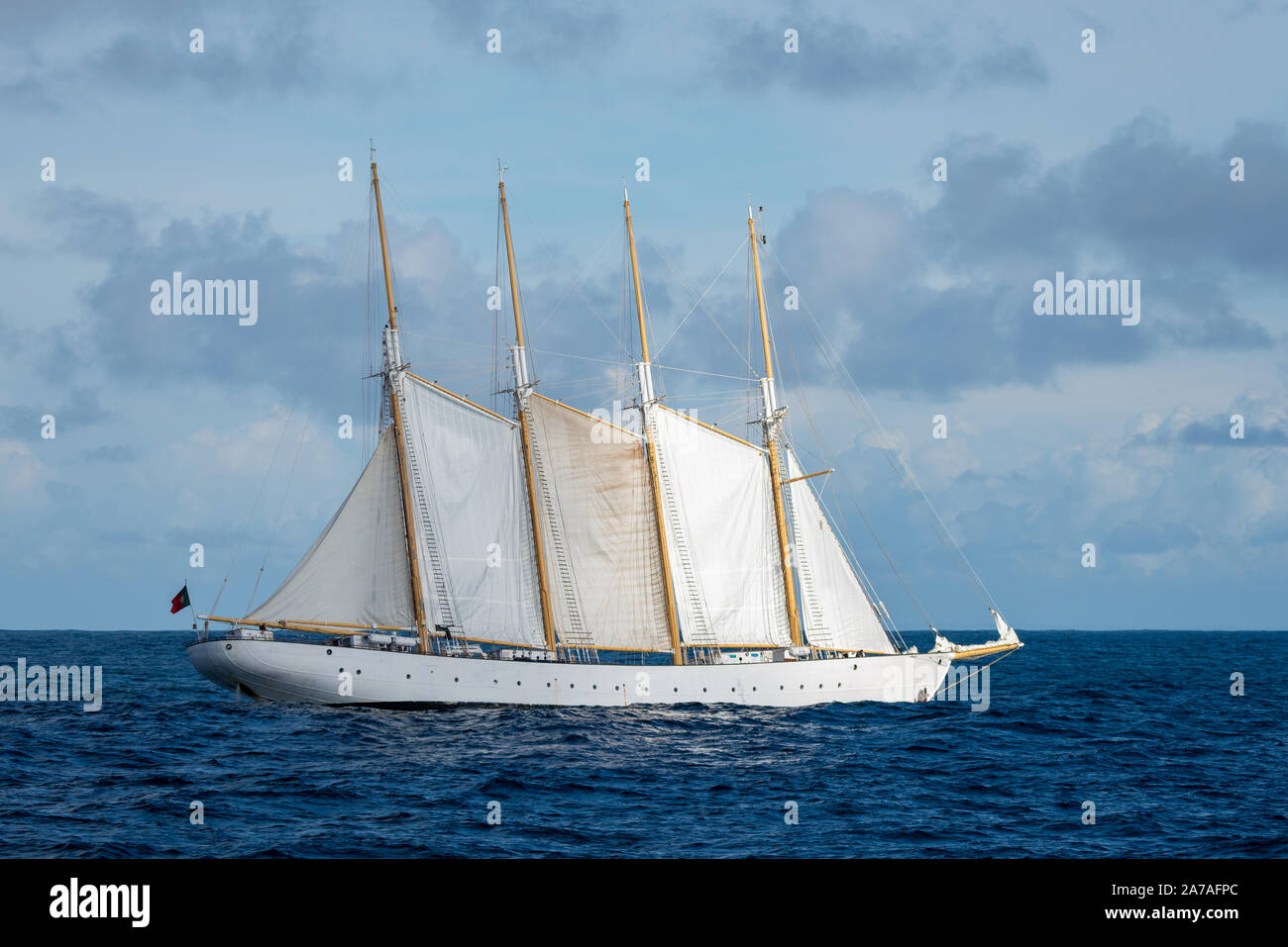 Sailing ship with four white sails Stock Photo - Alamy