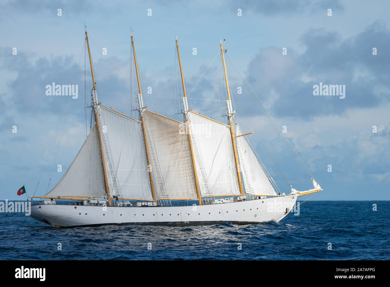 Sailing ship with four white sails Stock Photo - Alamy