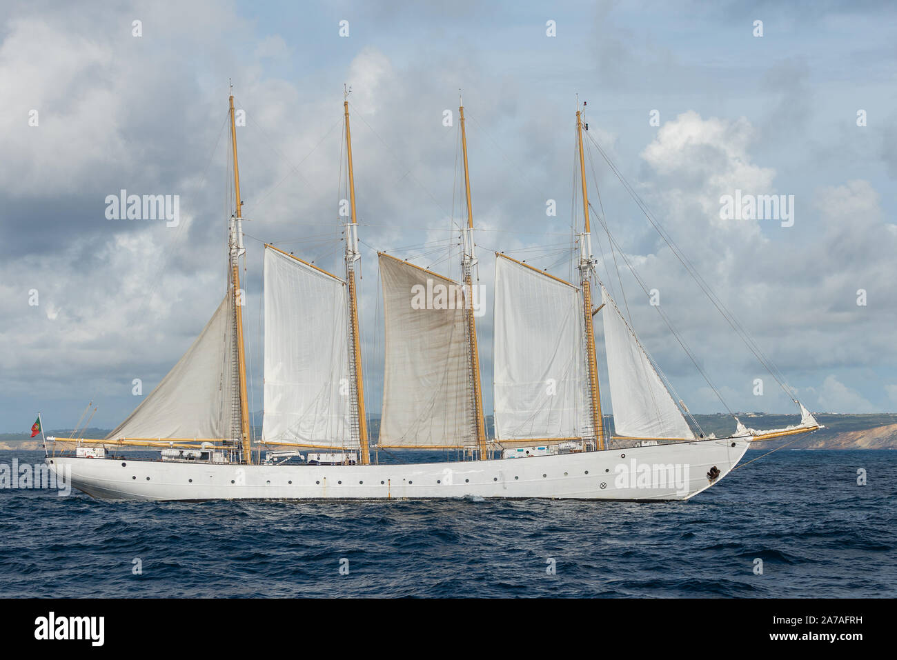 Sailing ship with four white sails Stock Photo - Alamy