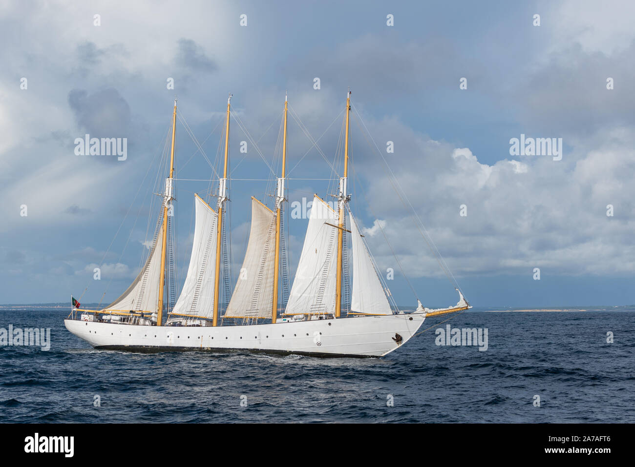 Sailing ship with four white sails Stock Photo - Alamy