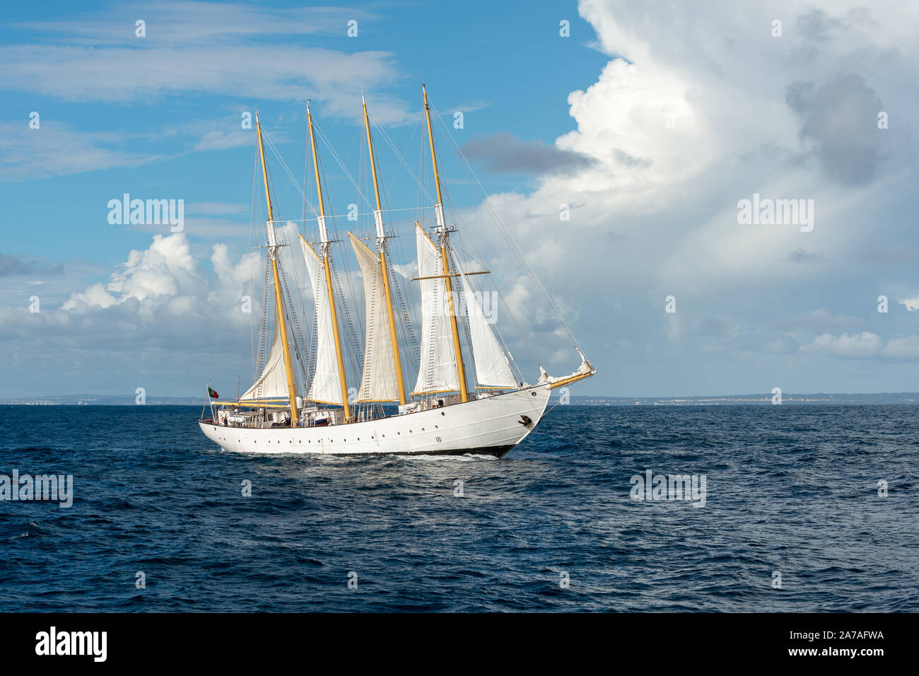 Sailing ship with four white sails Stock Photo - Alamy