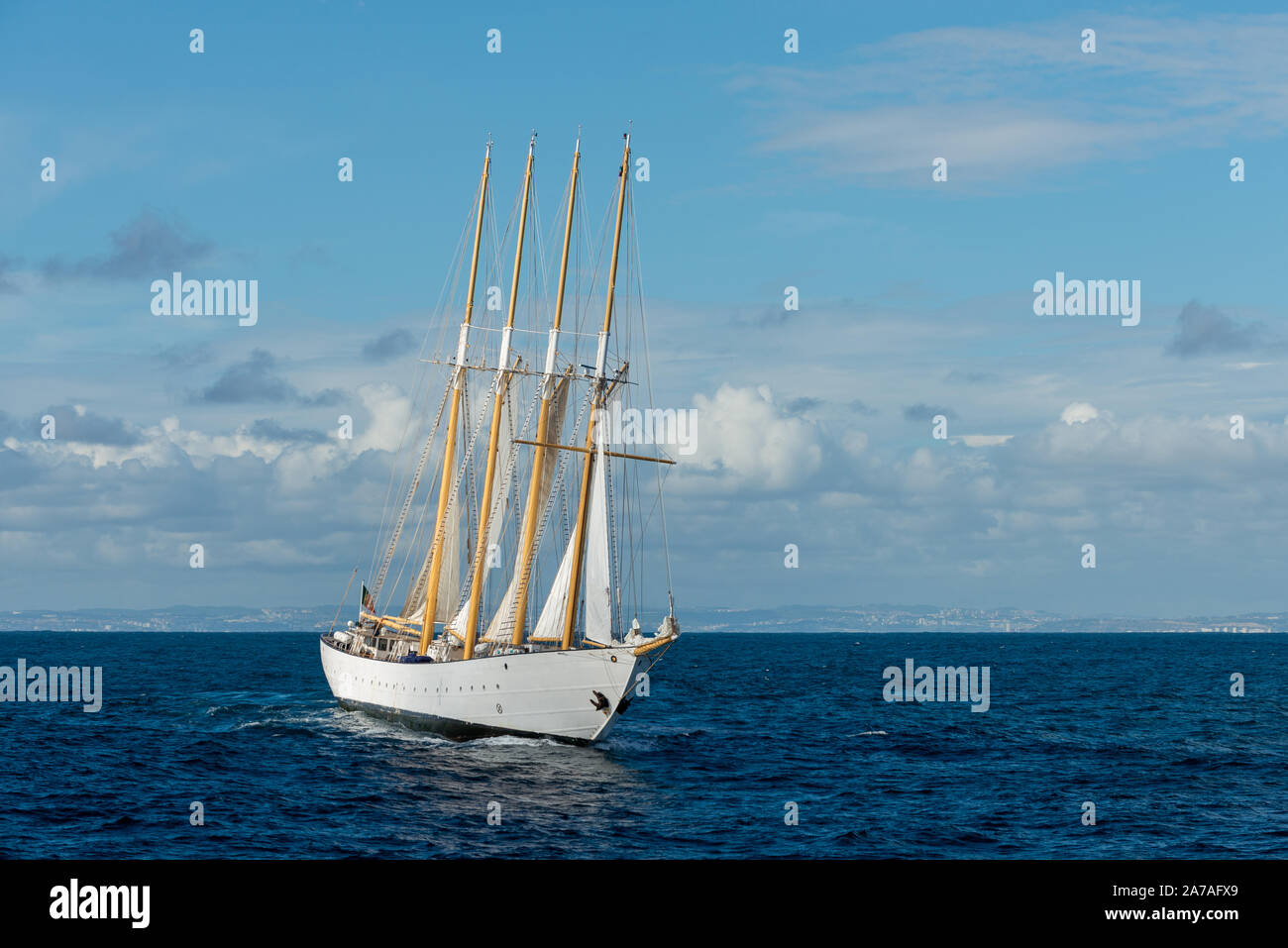 Sailing ship with four white sails Stock Photo - Alamy