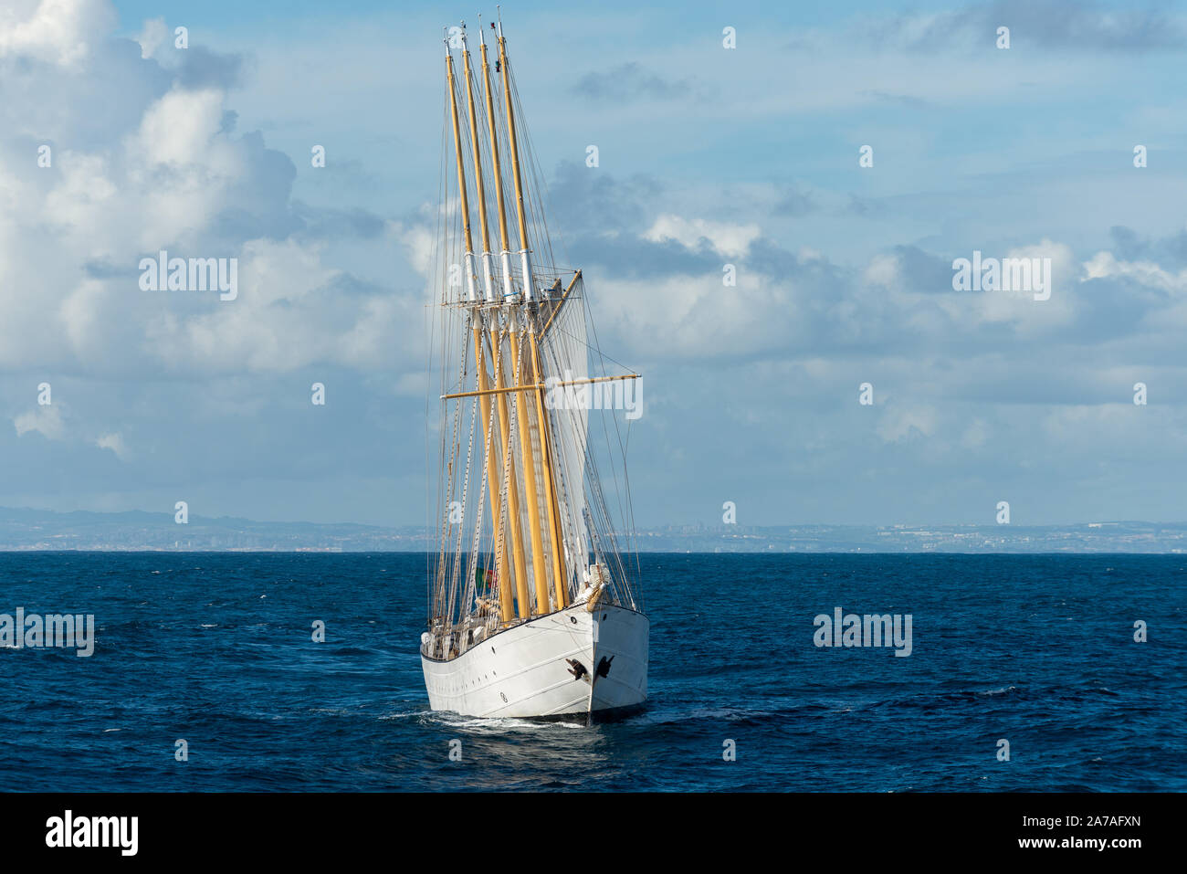 Sailing ship with four white sails Stock Photo - Alamy