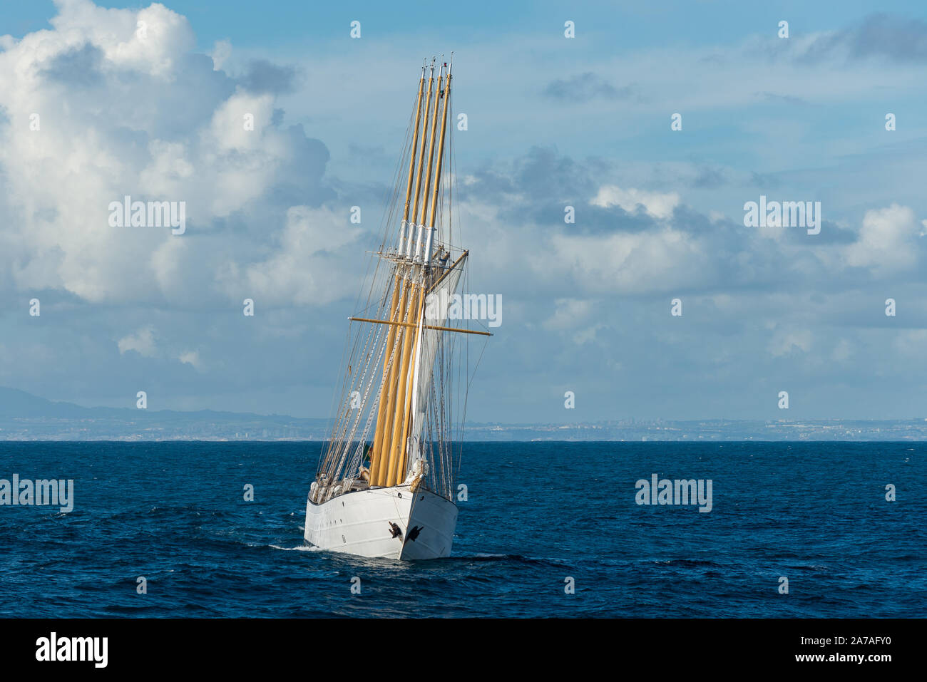 Sailing ship with four white sails Stock Photo - Alamy