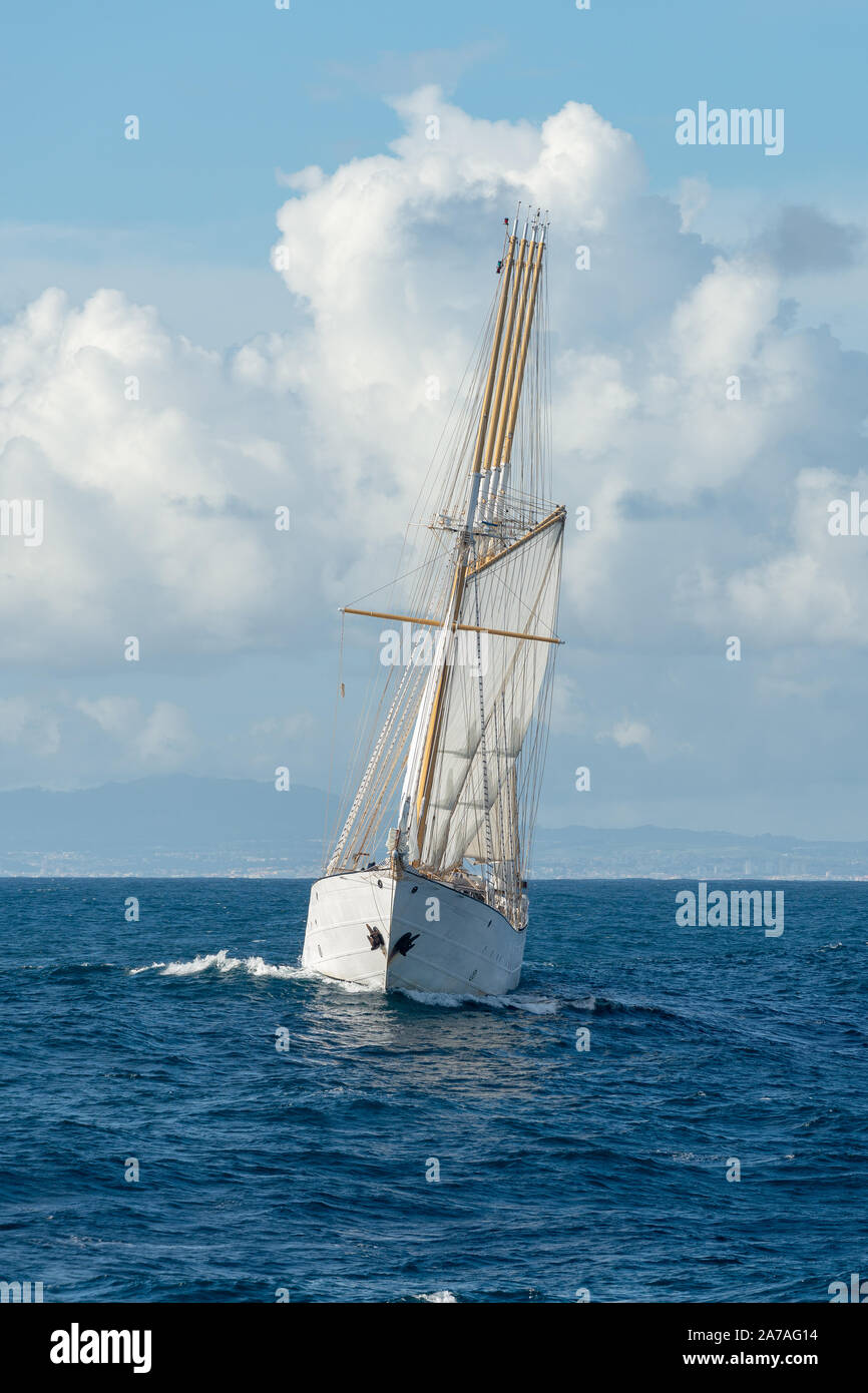 Sailing ship with four white sails Stock Photo - Alamy