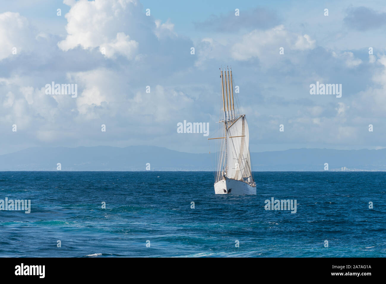 Sailing ship with four white sails Stock Photo - Alamy