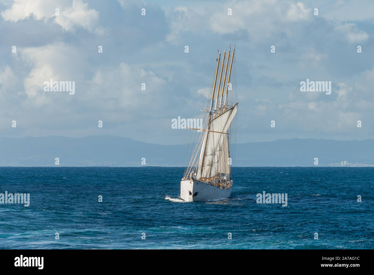 Sailing ship with four white sails Stock Photo - Alamy